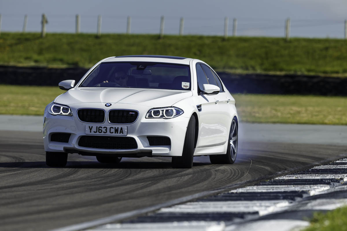 Nissan GT-R v BMW M5 track battle video | evo