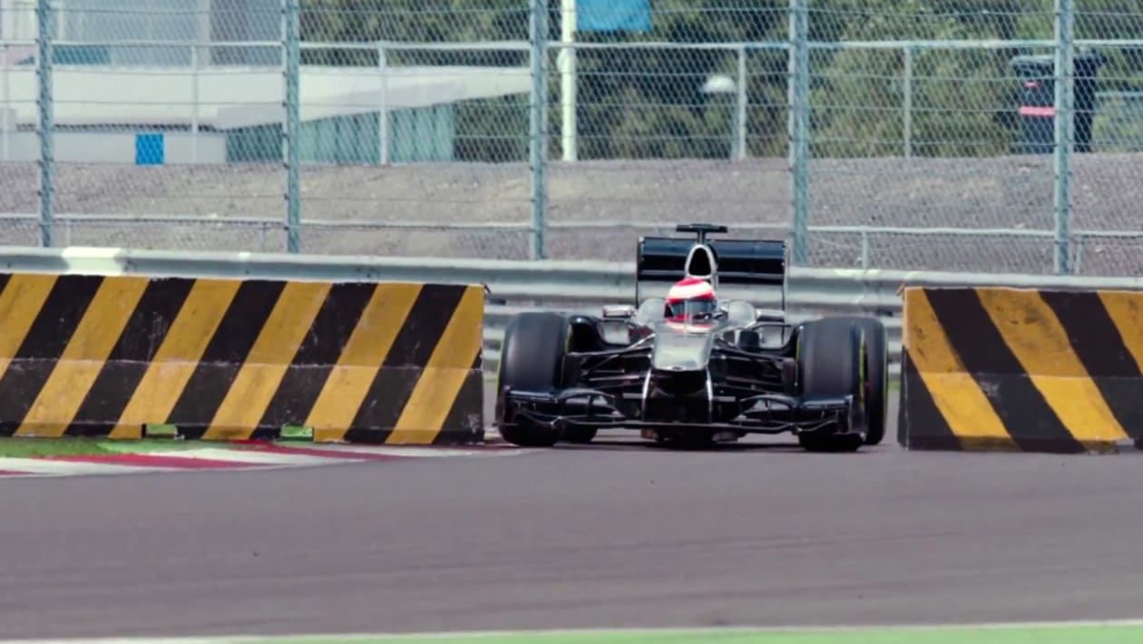 Watch - Jenson Button threads F1 car through impossibly small gaps | evo