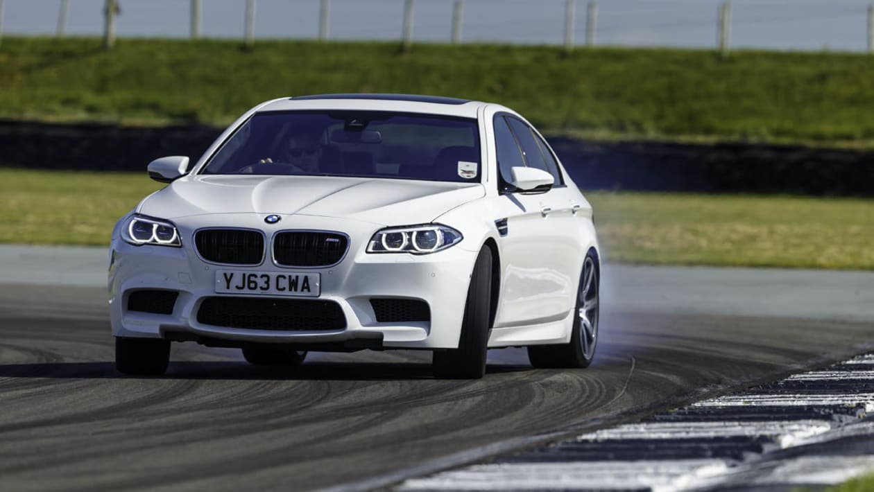 Nissan GT-R v BMW M5 track battle video | evo